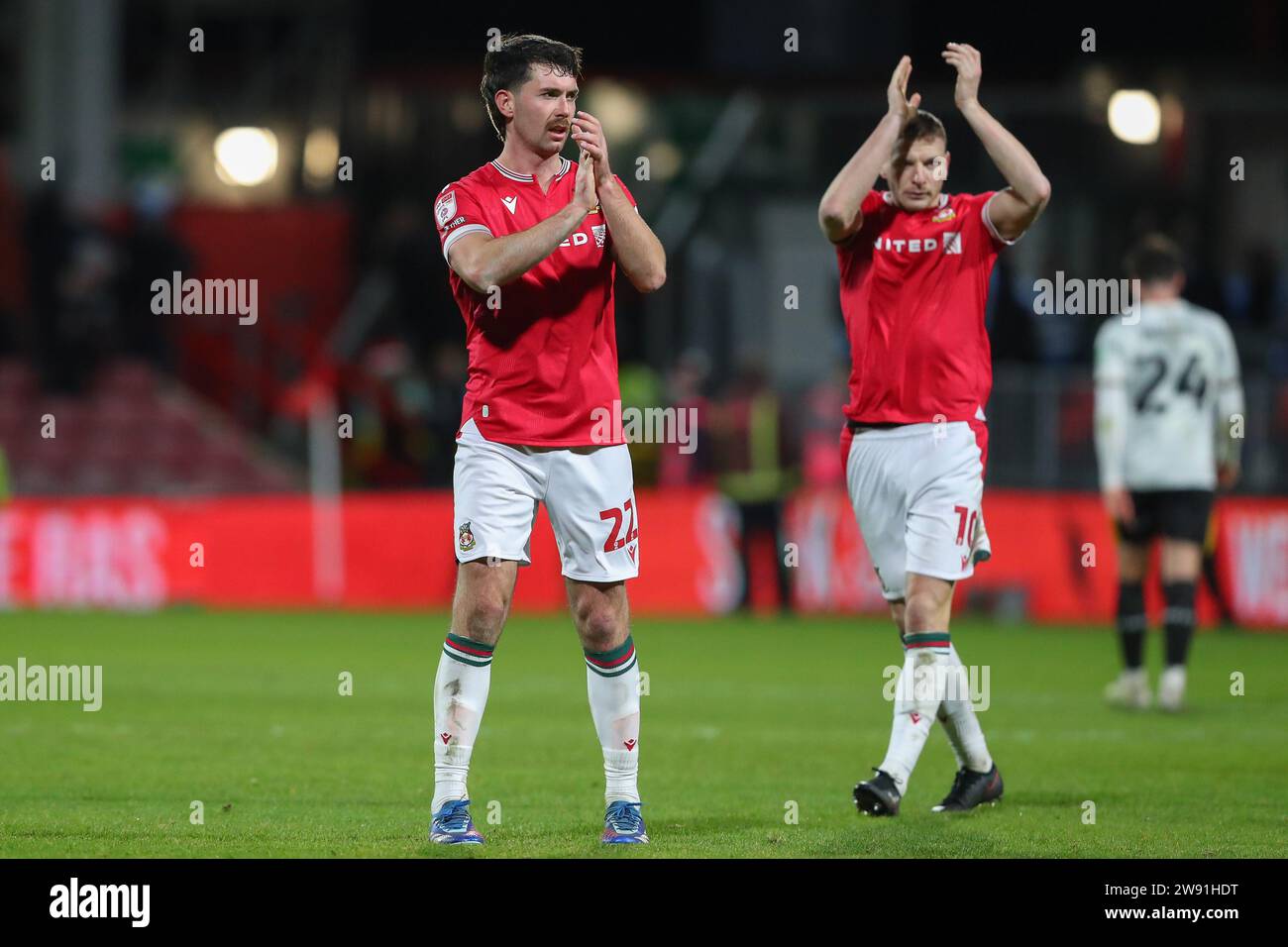 Thomas O'Connor #22 of Wrexham applauds the home fans after the Sky Bet ...