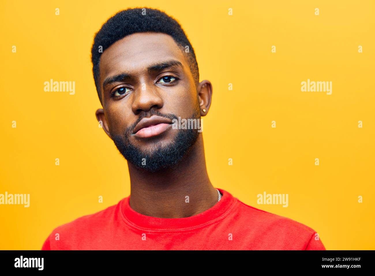 Happy young African American gen z guy isolated on beige background ...