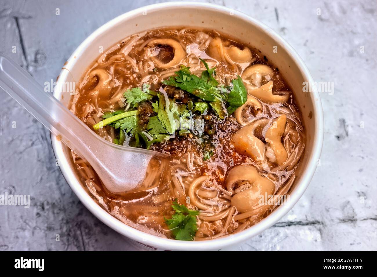 Thick gravy noodles at the famous Ay-Chung Flour Rice Noodles, Taipei ...