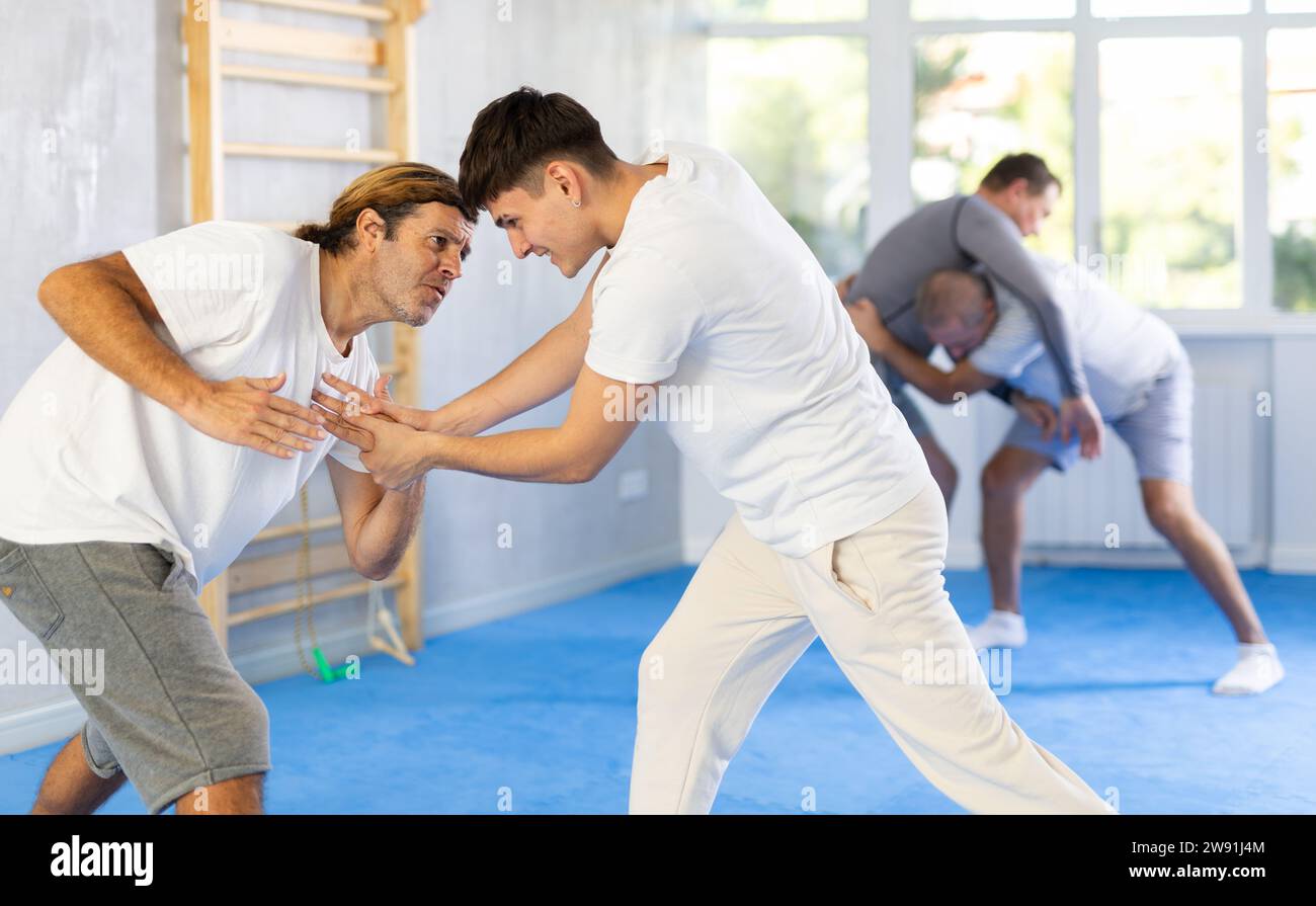 Self defense training for adults - men learn how to do power grabs ...