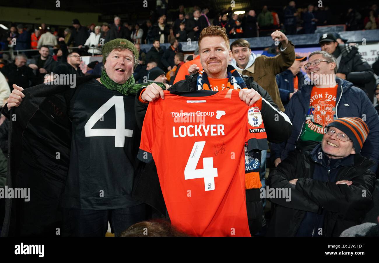 Fans hold up Luton Town's Tom Lockyer shirt after the Premier League ...