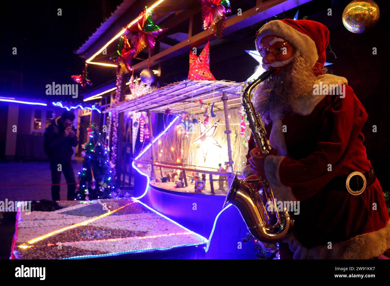 Srinagar Kashmir, India. 23rd Dec, 2023. A decorated Santa Claus is seen at the Holy Family ...
