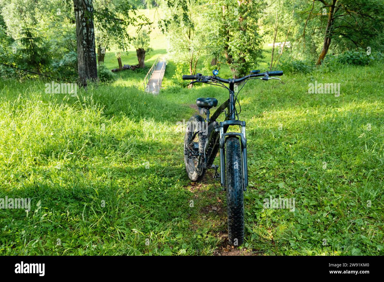 Electric bike with thick wheels in the village. Healthy sports hobby ...