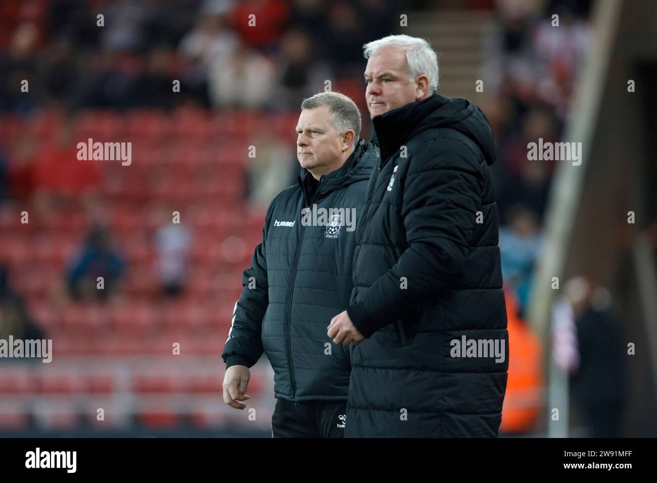 Coventry City manager Mark Robins (left) and assistant manager Adi ...