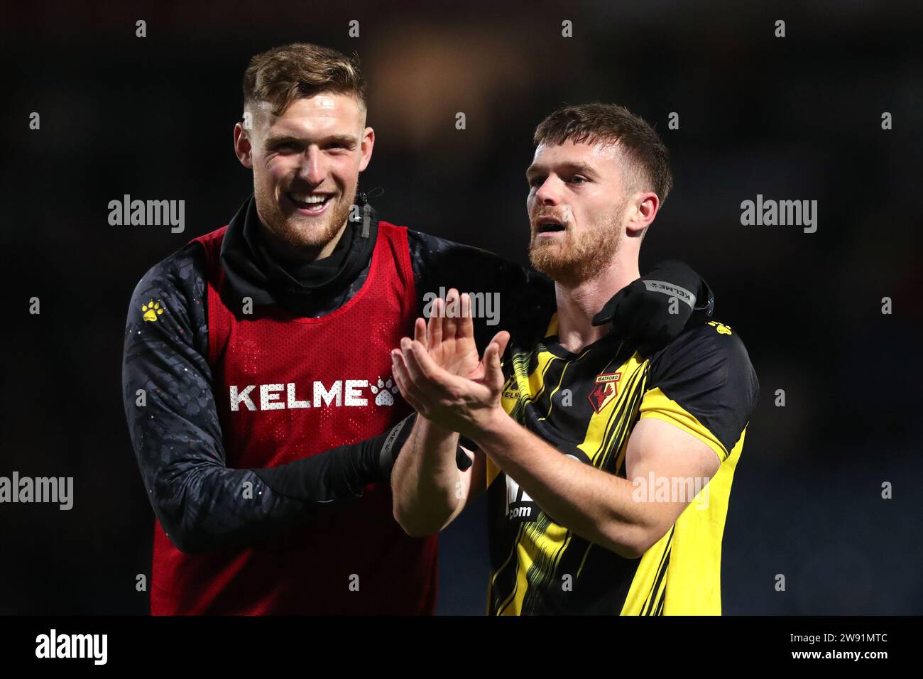 Watford’s Rhys Healey (right) and Watford’s Mattie Pollock applaud the ...