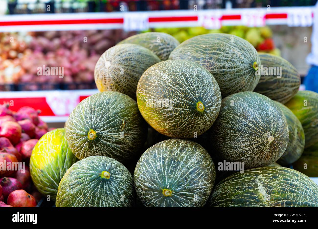 Bunch of melons in store Stock Photo - Alamy
