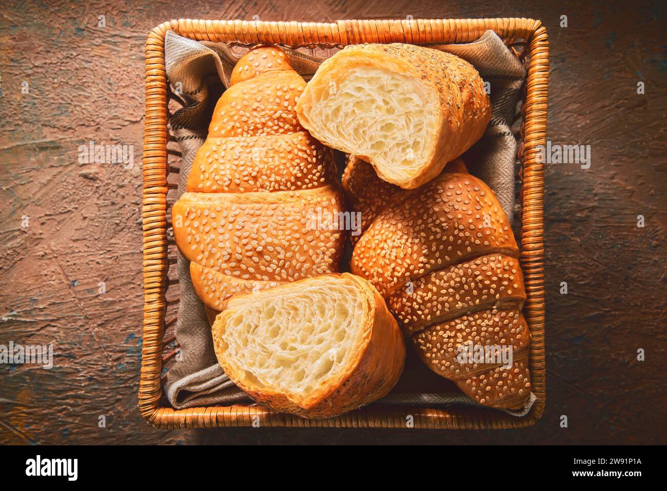 Delicious fresh baking croissant with sesame and thyme . Top view with ...