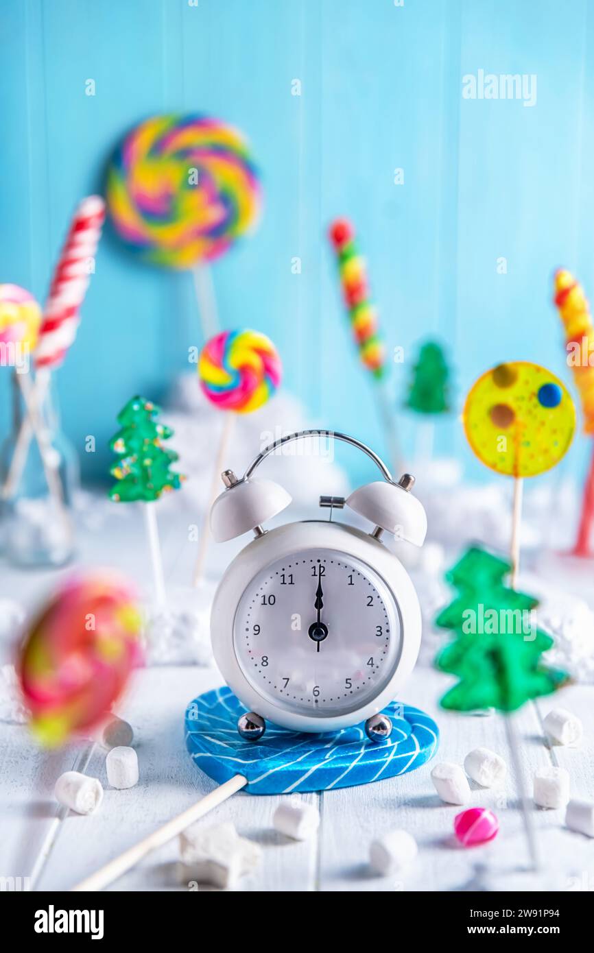 A bright light composition of multi-colored lollipops. alarm clock, New ...