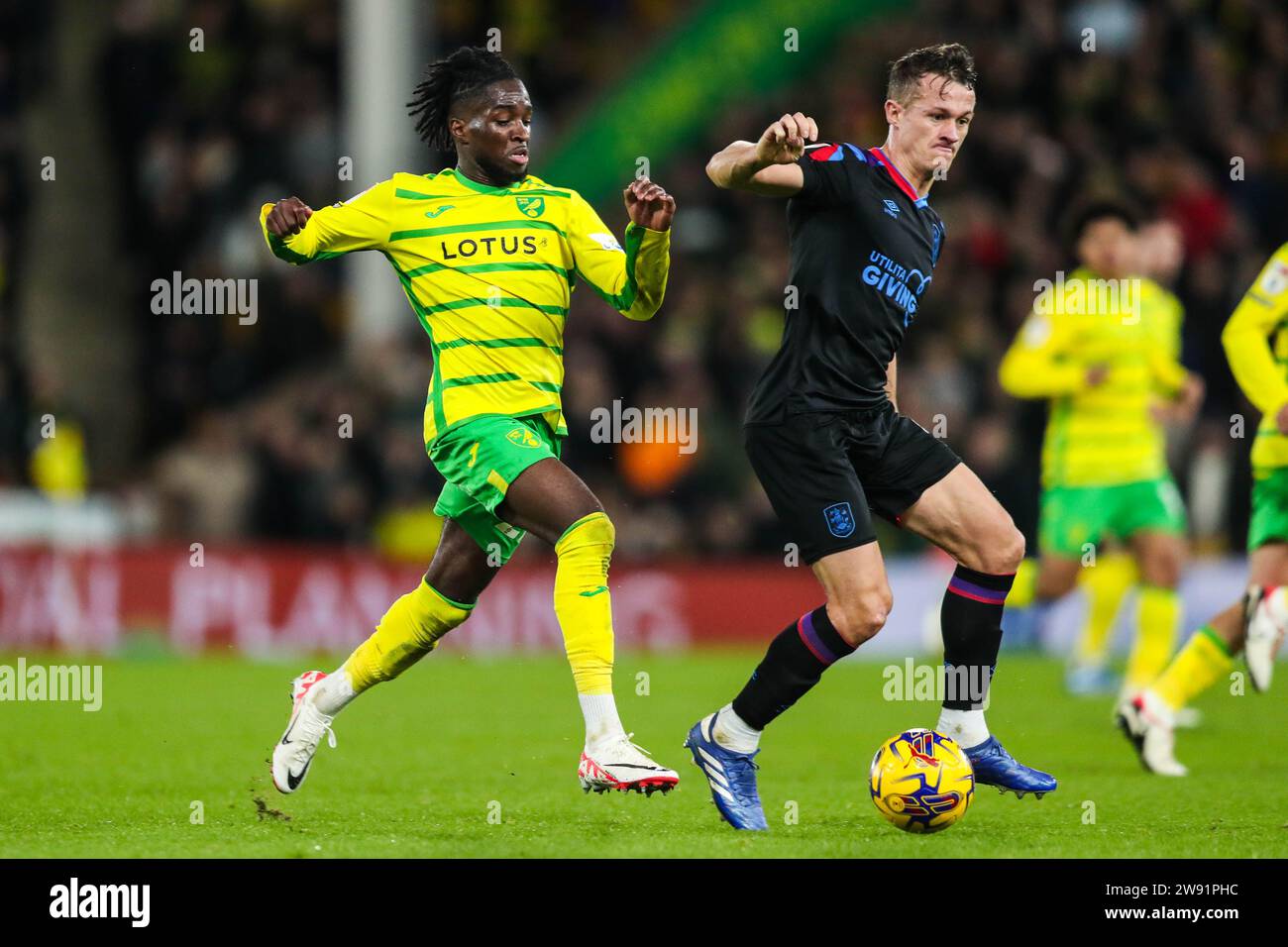 Norwich City's Jonathan Rowe battles for the ball against Huddersfield ...