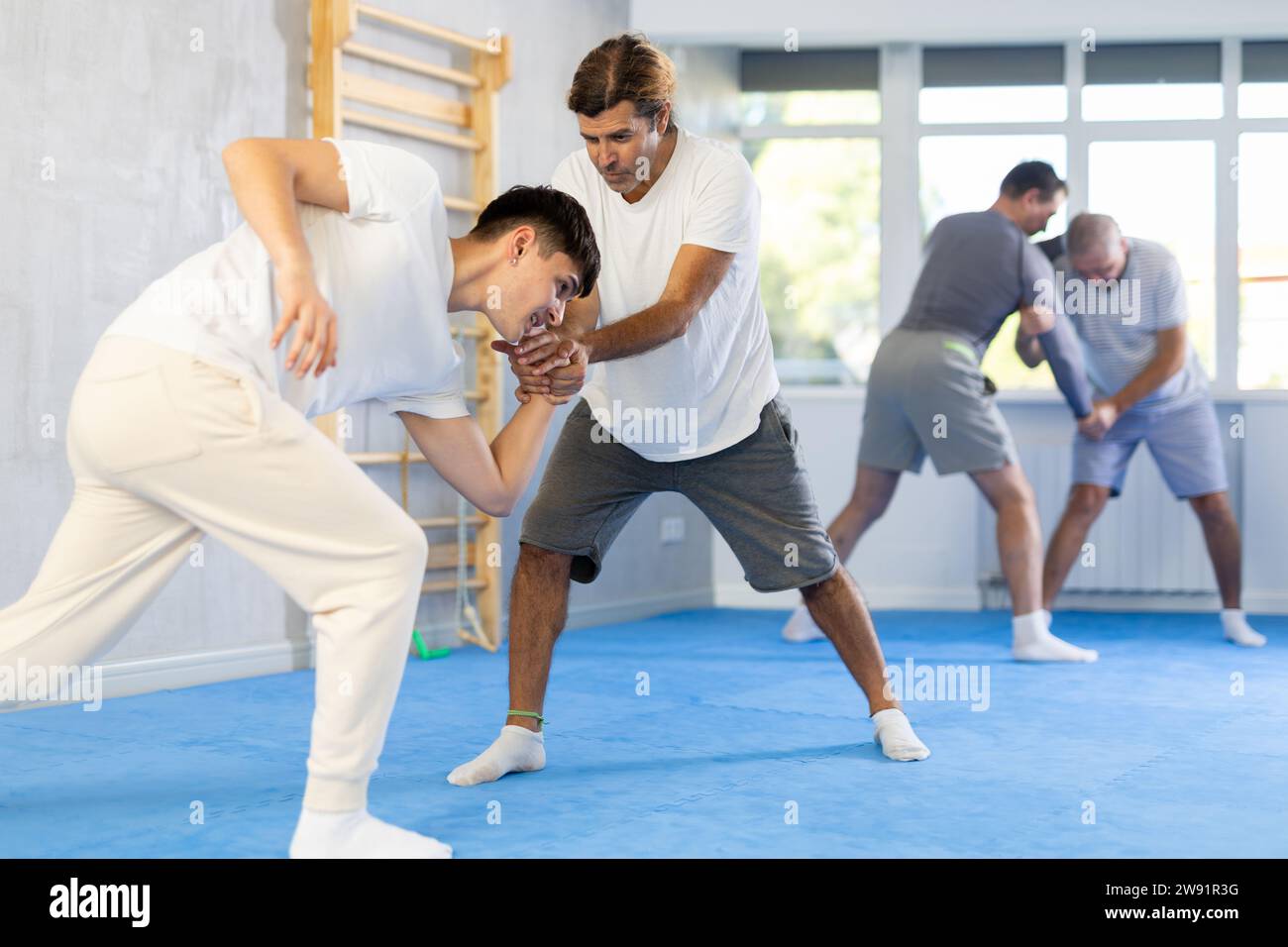 Two men training judo technique in studio Stock Photo - Alamy