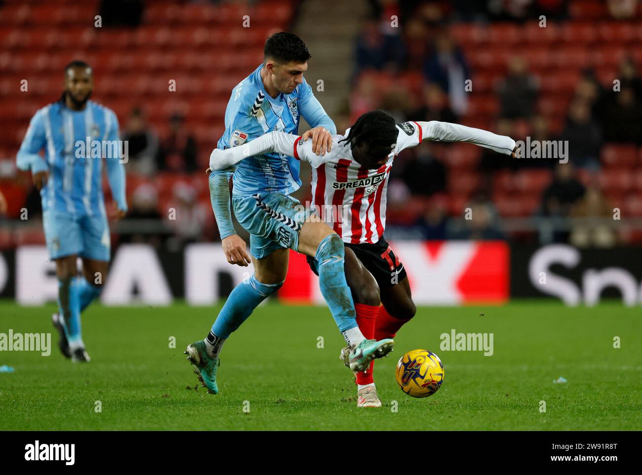 Coventry City's Bobby Thomas (left) and Sunderland's Eliezer Mayenda ...