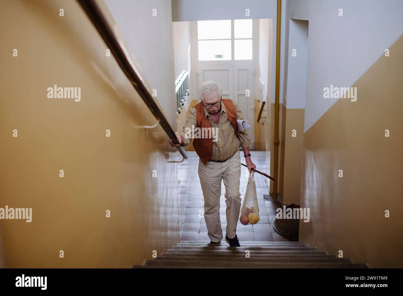 Man moving up stairs hi-res stock photography and images - Alamy