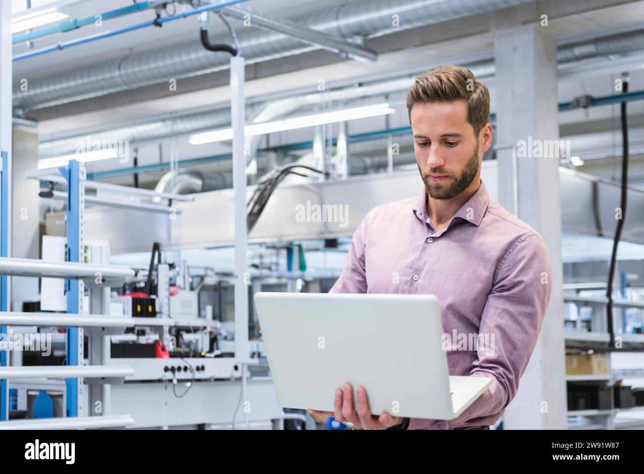 Male engineer working laptop industrial hi-res stock photography and ...
