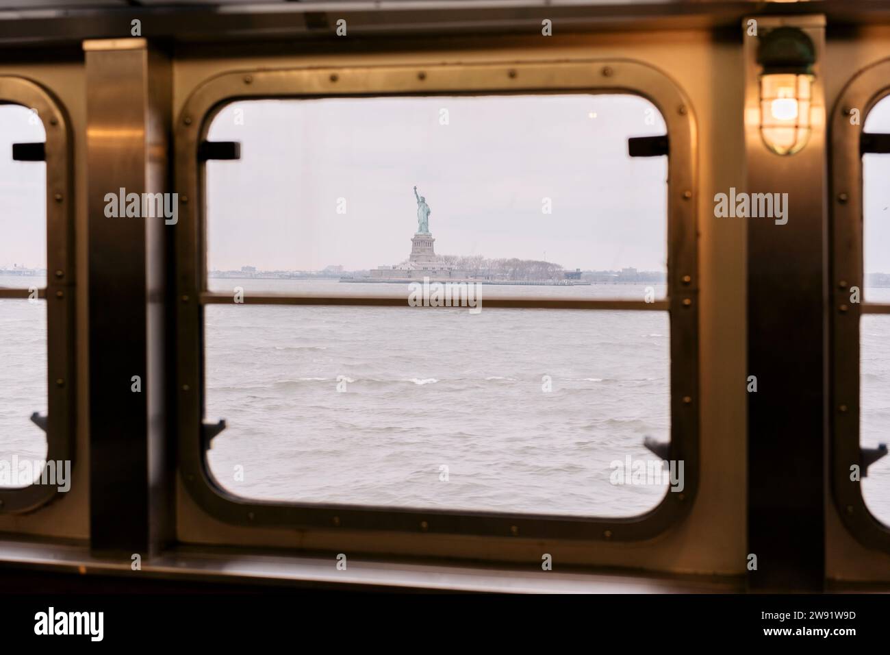 Statue of Liberty seen through window of Staten Island Ferry in Hudson ...