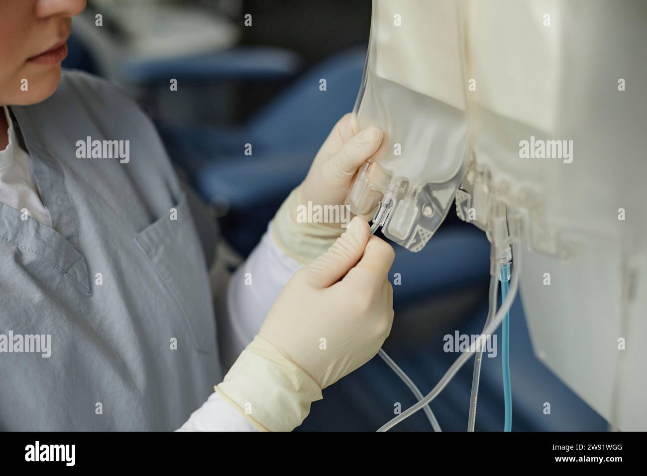 Medical worker attaching blood collection tubes to bags Stock Photo - Alamy