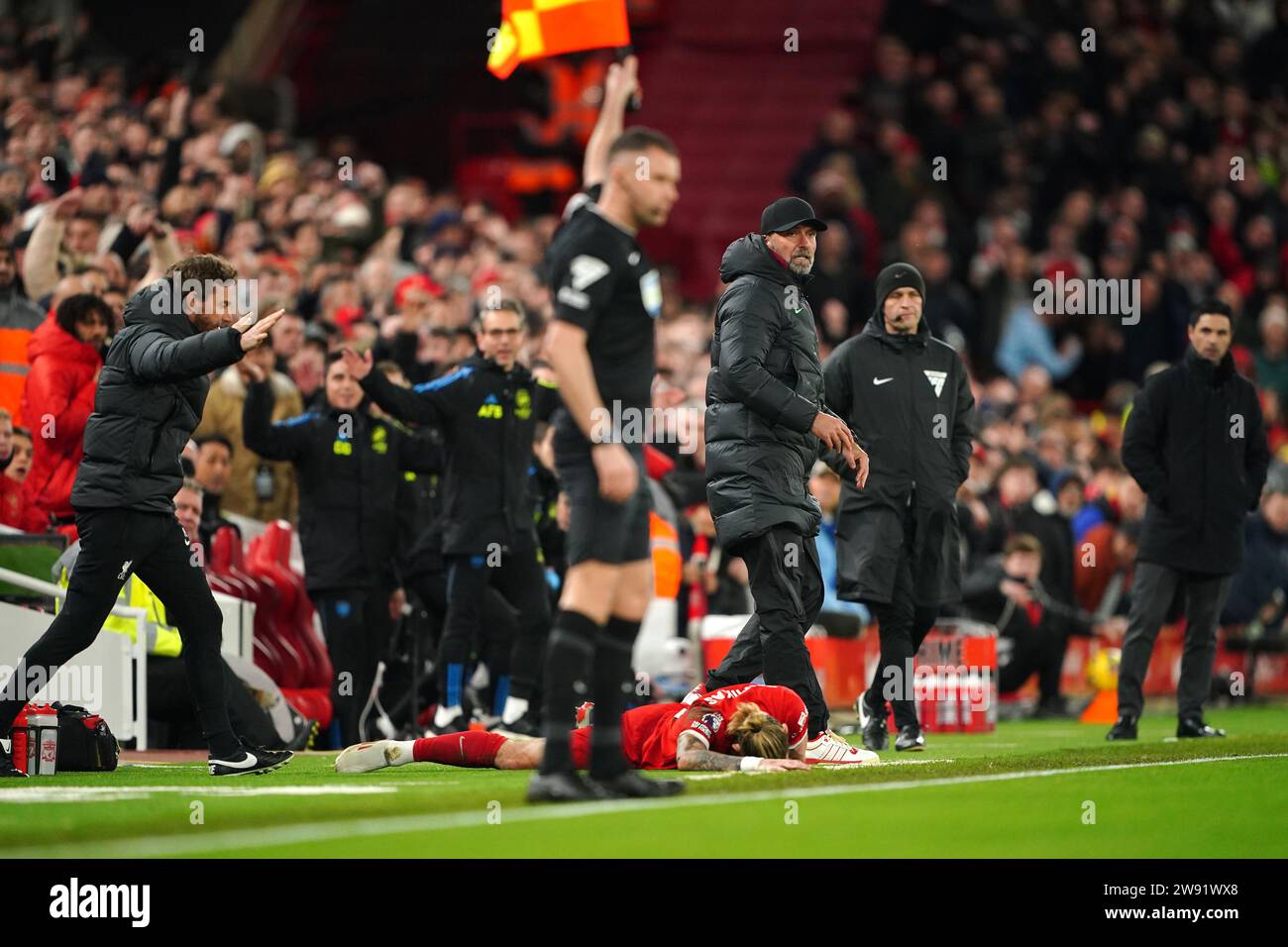 Liverpool's Kostas Tsimikas appears injured after colliding in to ...