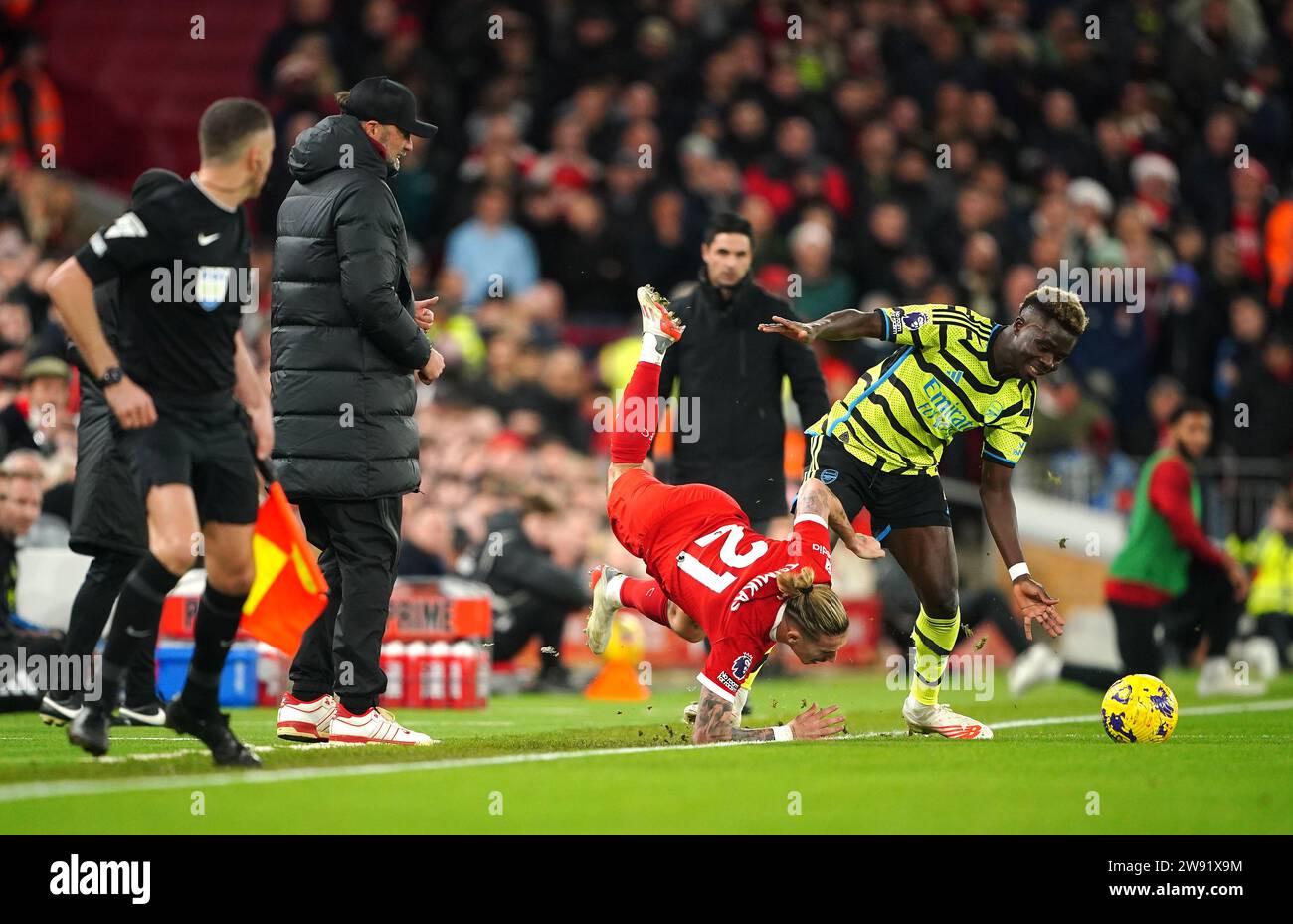 Arsenal's Bukayo Saka (right) and Liverpool's Kostas Tsimikas battle ...