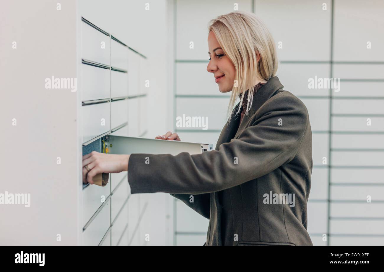 Person picking up parcel hi-res stock photography and images - Alamy