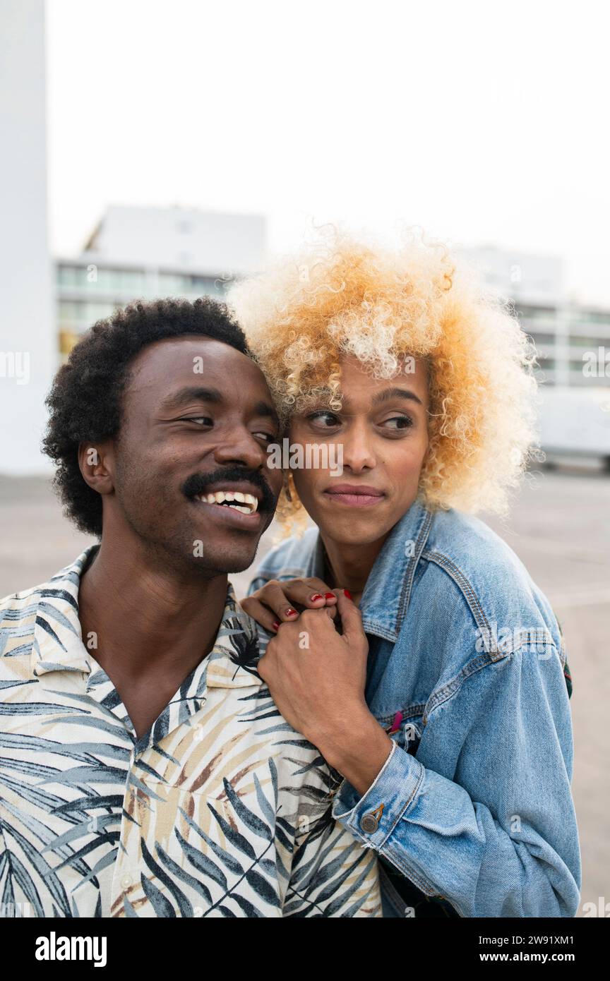 Young transgender woman with hands on shoulder of boyfriend Stock Photo ...
