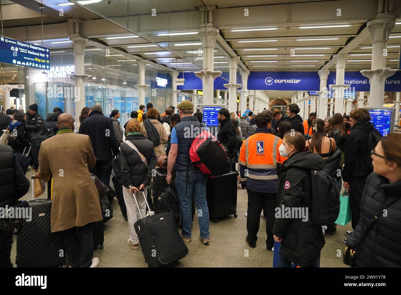 Passengers wait at the Eurostar entrance in St Pancras International ...