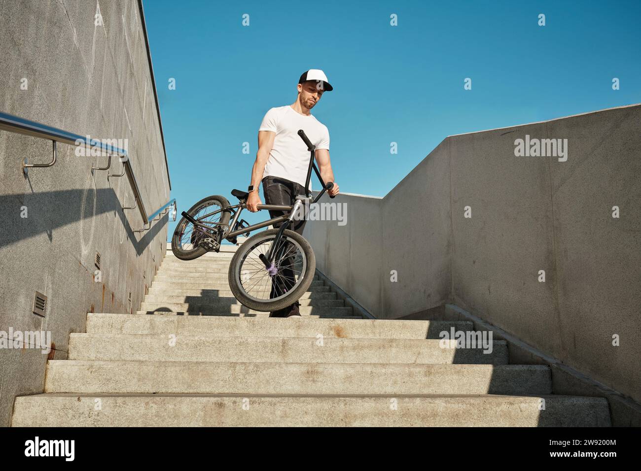 Man moving down on staircase hi-res stock photography and images - Alamy