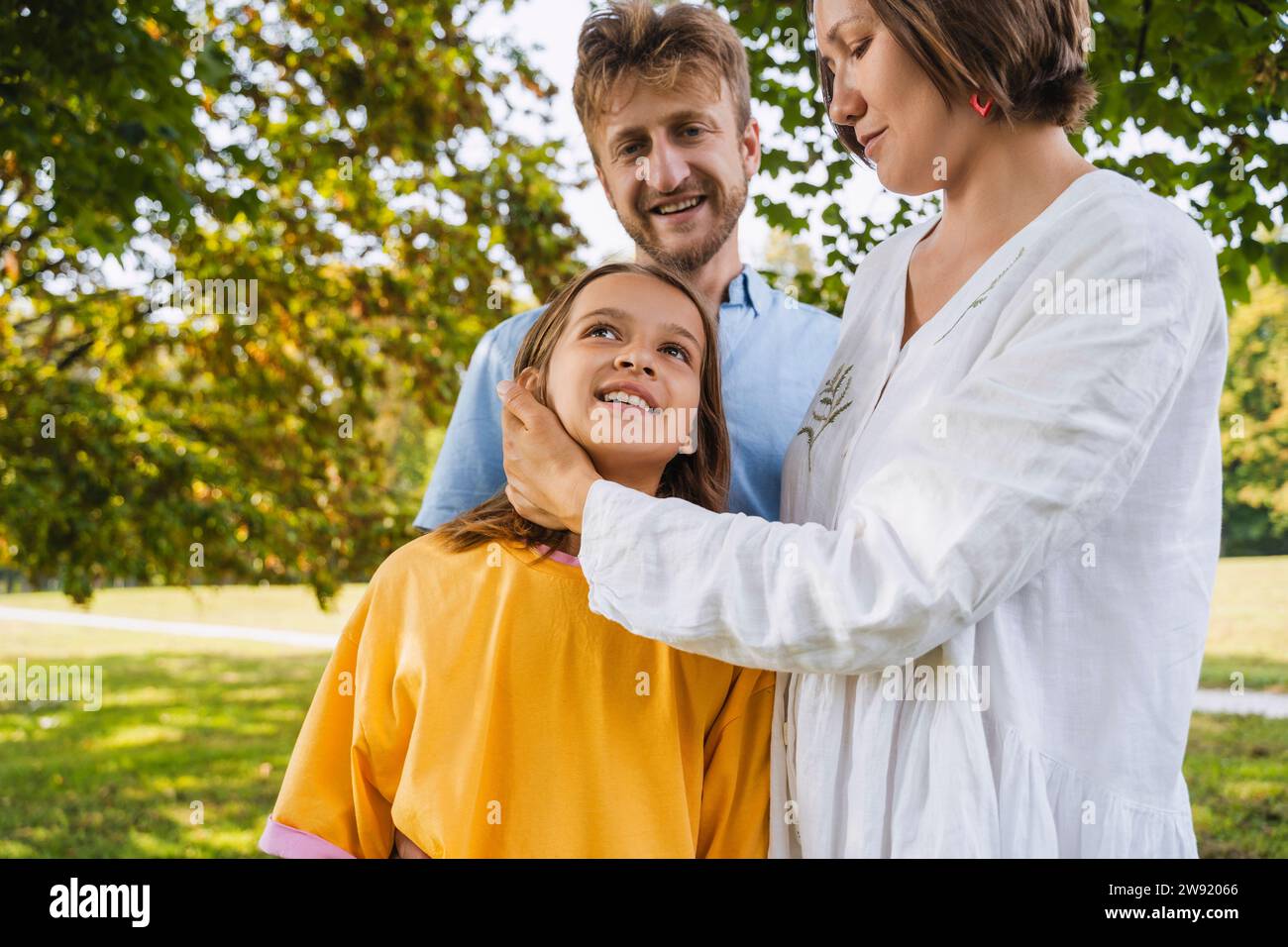 Daughter caressing mother hi-res stock photography and images - Alamy
