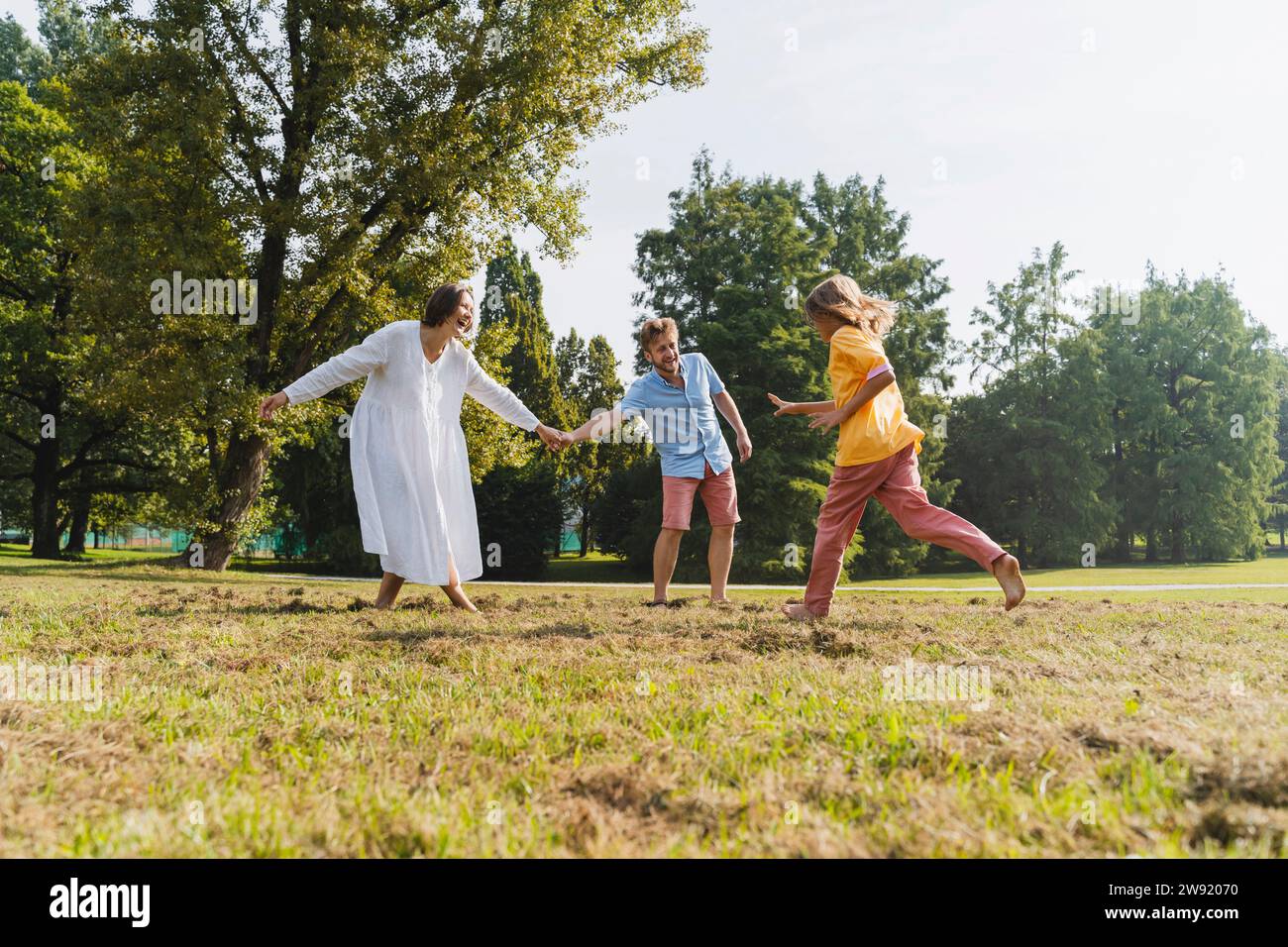 Child children playing running fun green grass hi-res stock photography ...