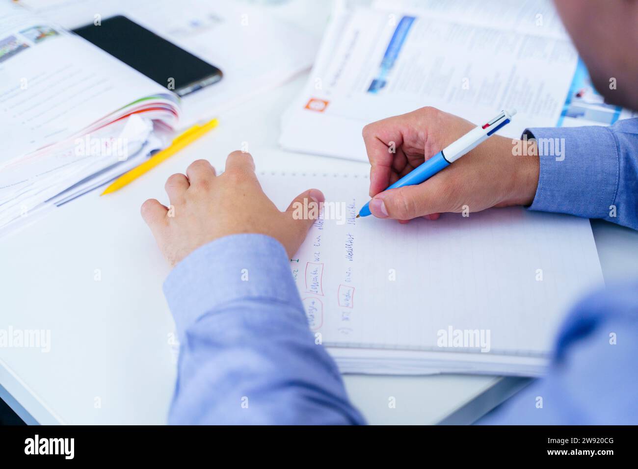 Student writing paper desk hi-res stock photography and images - Alamy