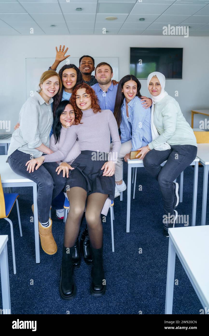 Multi-ethnic smiling students in training class at classroom Stock Photo - Alamy