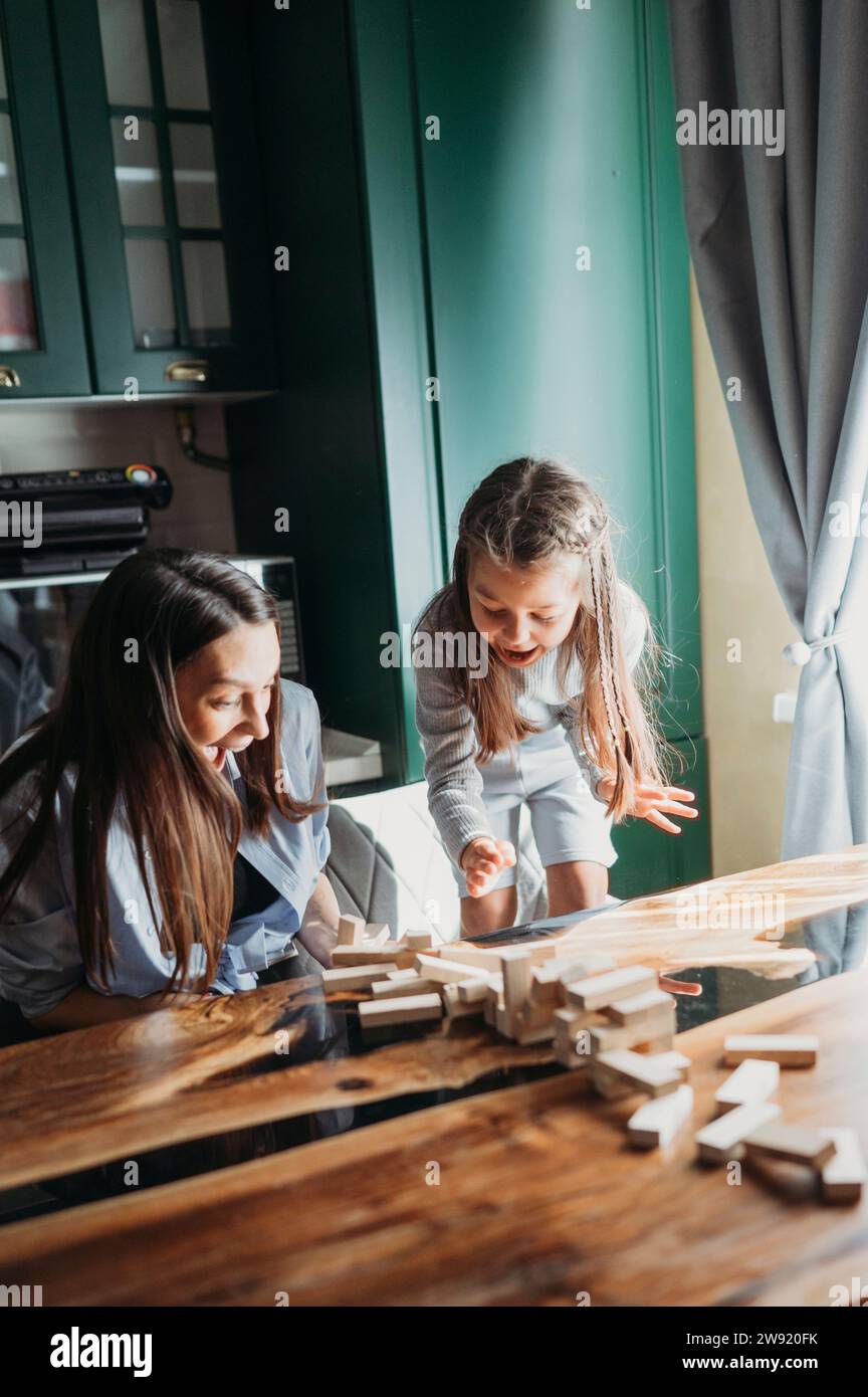 Child with fallen building blocks hi-res stock photography and images ...