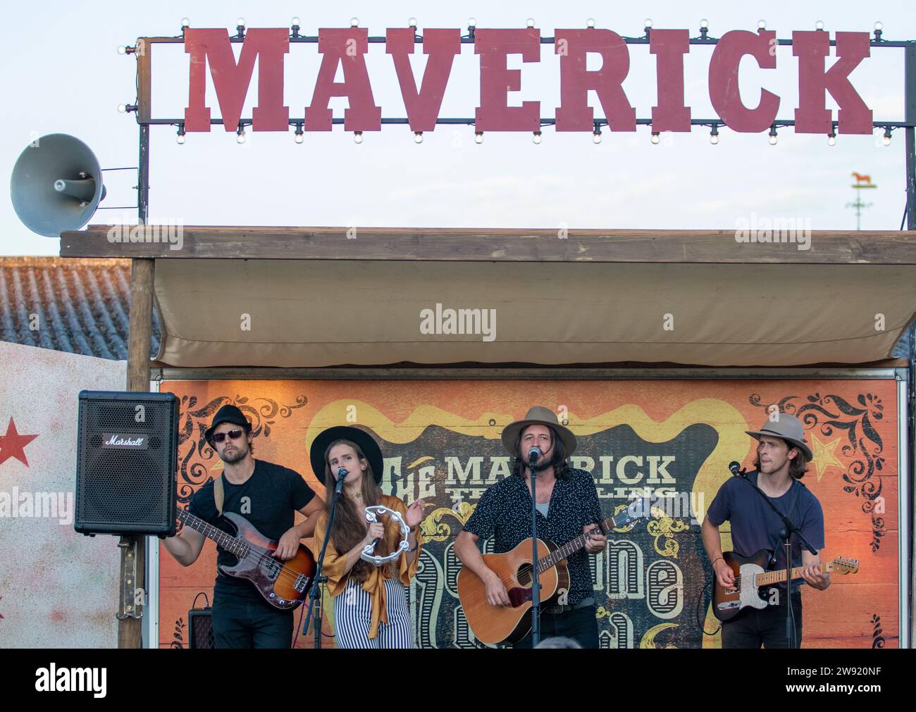Local woman singer/songwriter Kelly Bayfield on stage with friends at ...