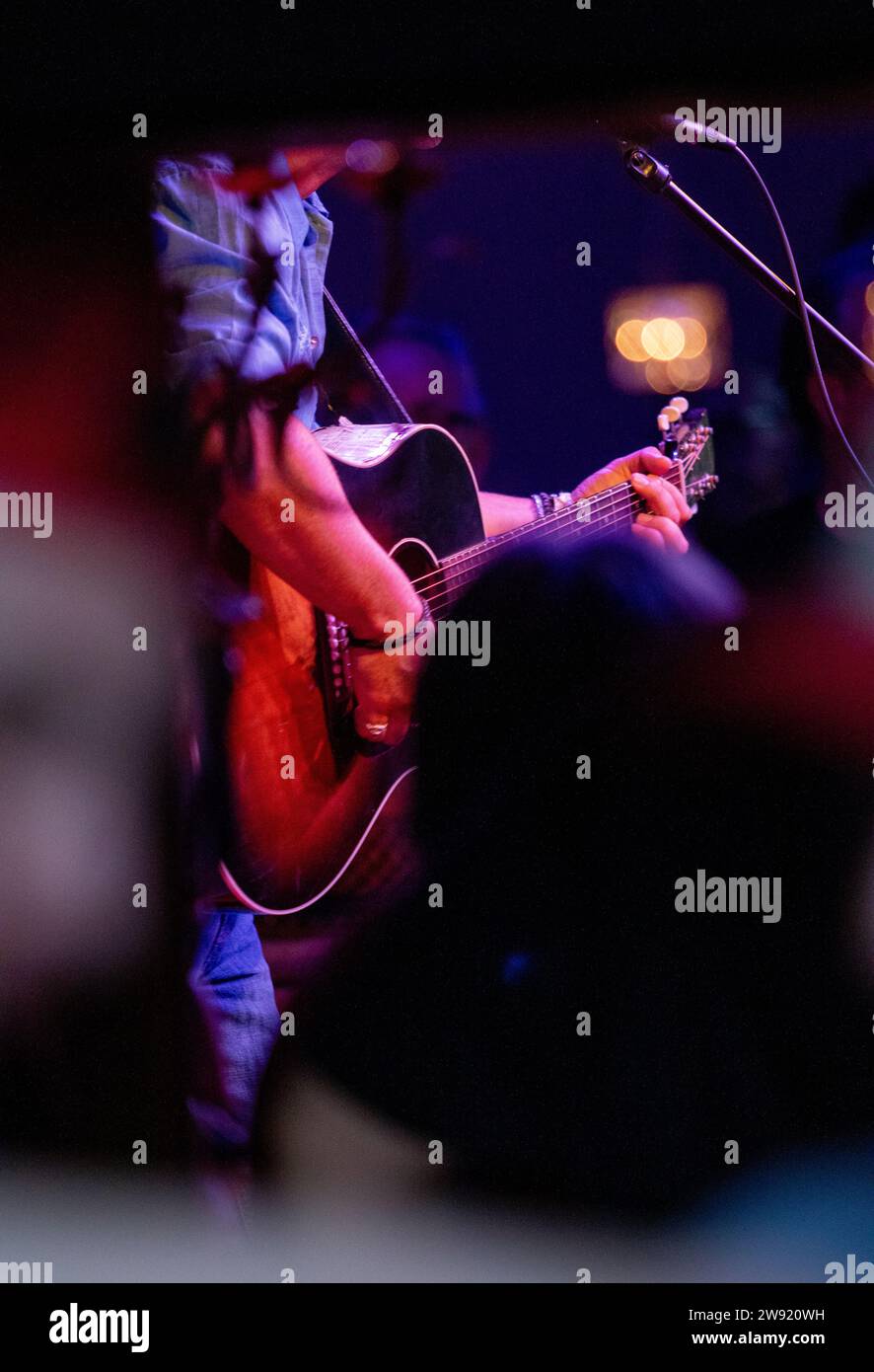 Soft focus detail of musician playing an acoustic guitar at The ...