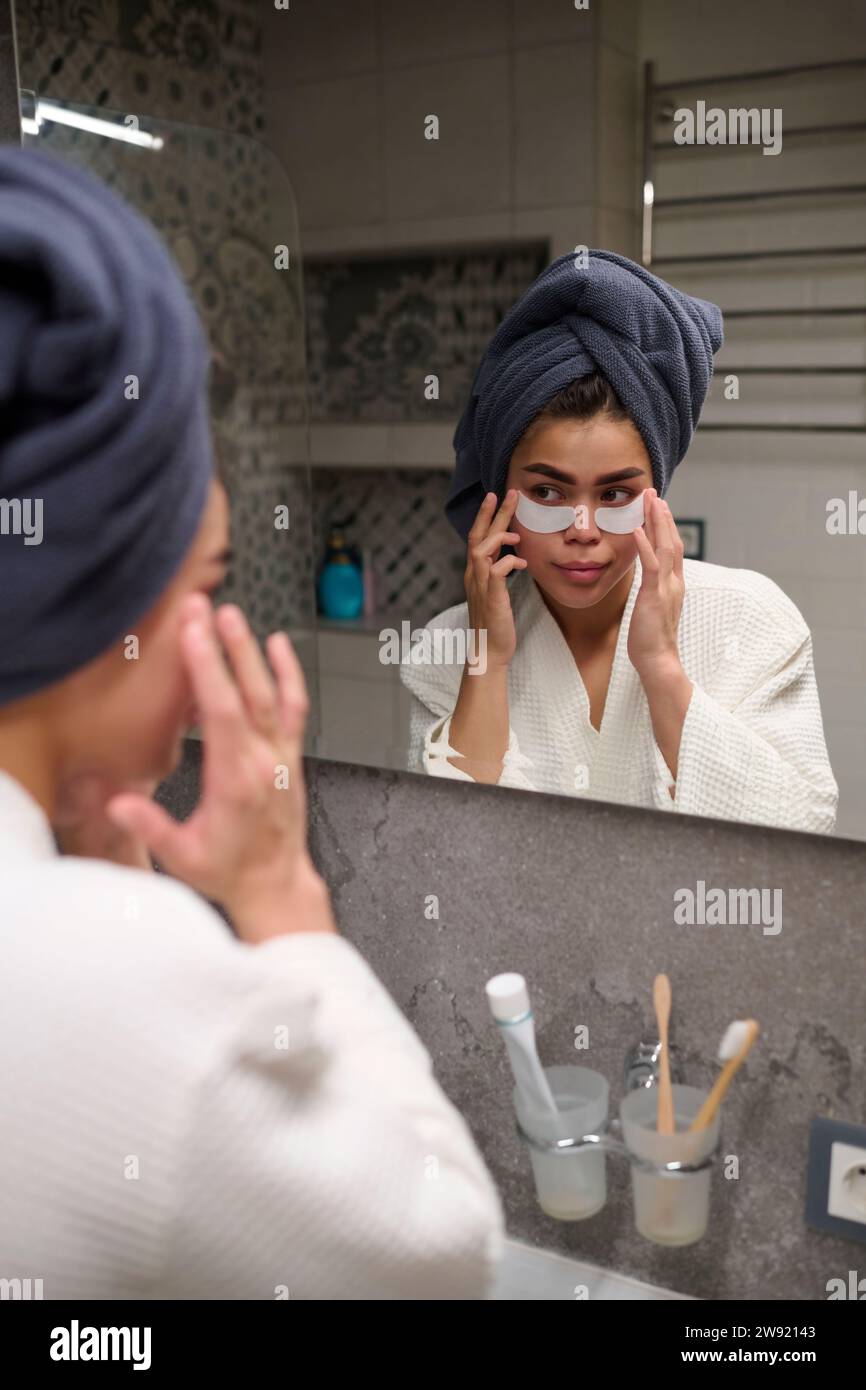 Woman applying a patch hi-res stock photography and images - Alamy