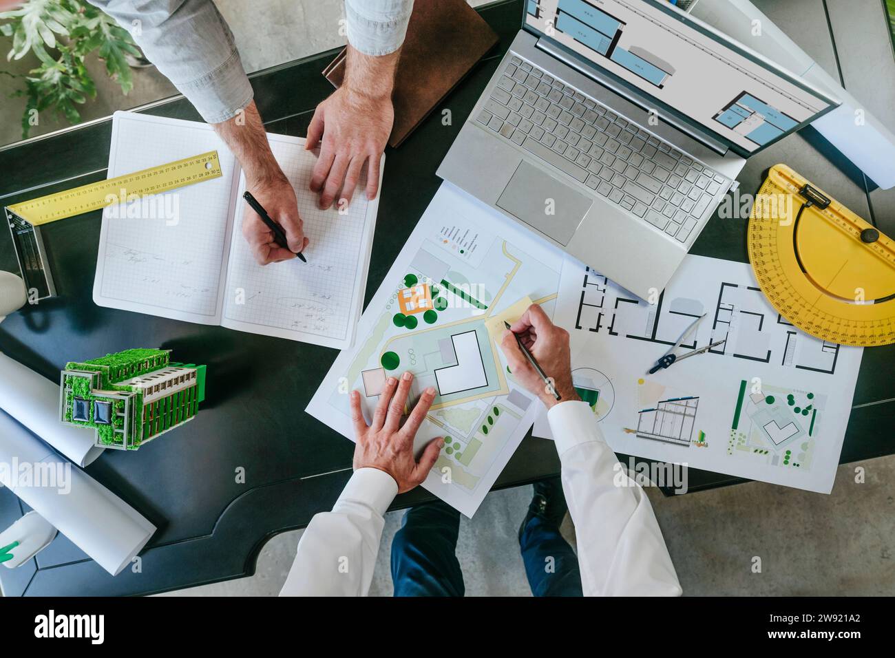 Engineer working blueprints on desk hi-res stock photography and images ...