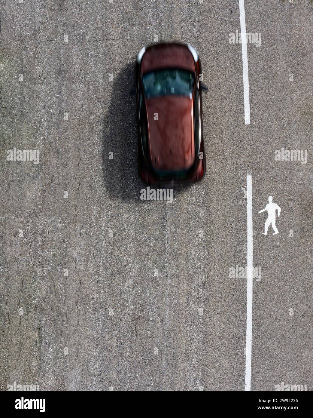 Car passing crosswalk markings on asphalt road Stock Photo - Alamy