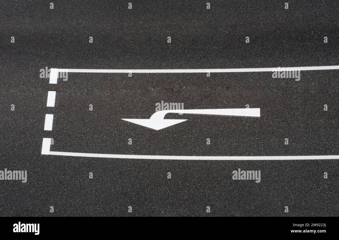 Left turn road marking on asphalt road Stock Photo - Alamy