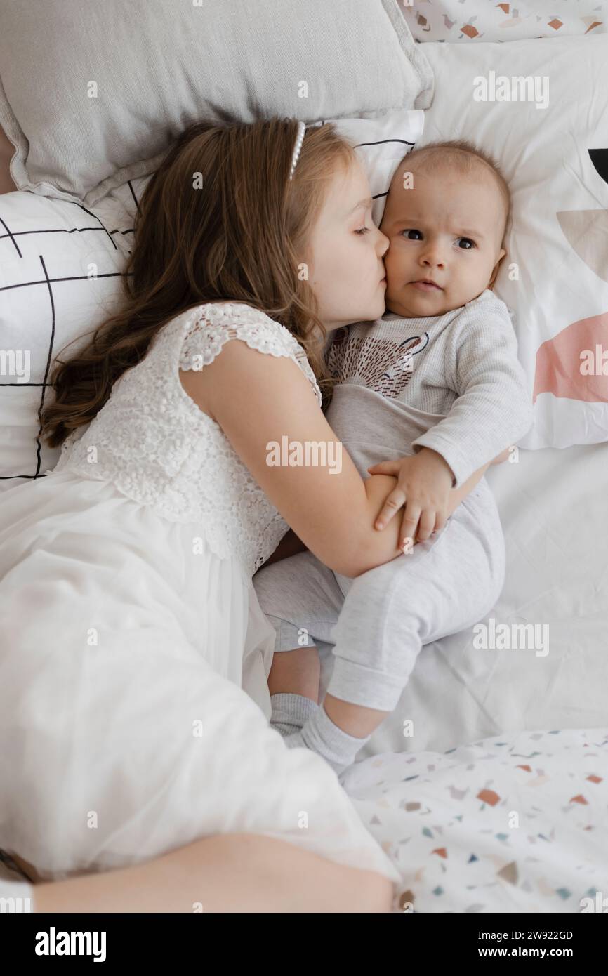 Brother kissing his sister on the cheek hi-res stock photography and ...