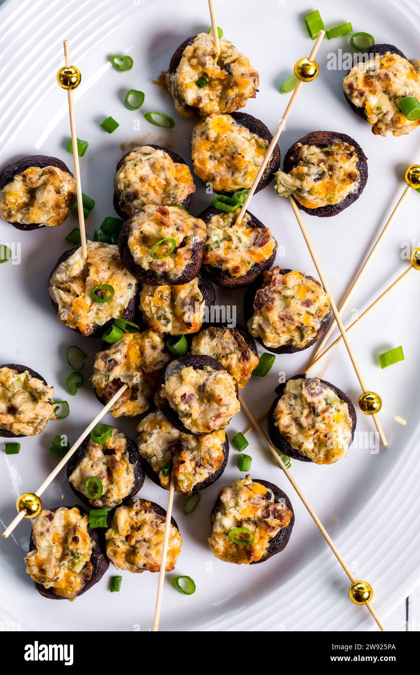 A platter of creamy cheese stuffed mushroom caps, ready for sharing ...