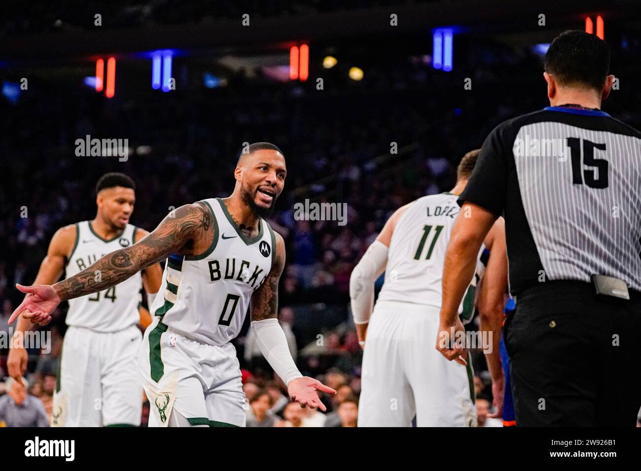 Milwaukee Bucks guard Damian Lillard (0) argues a call with referee ...