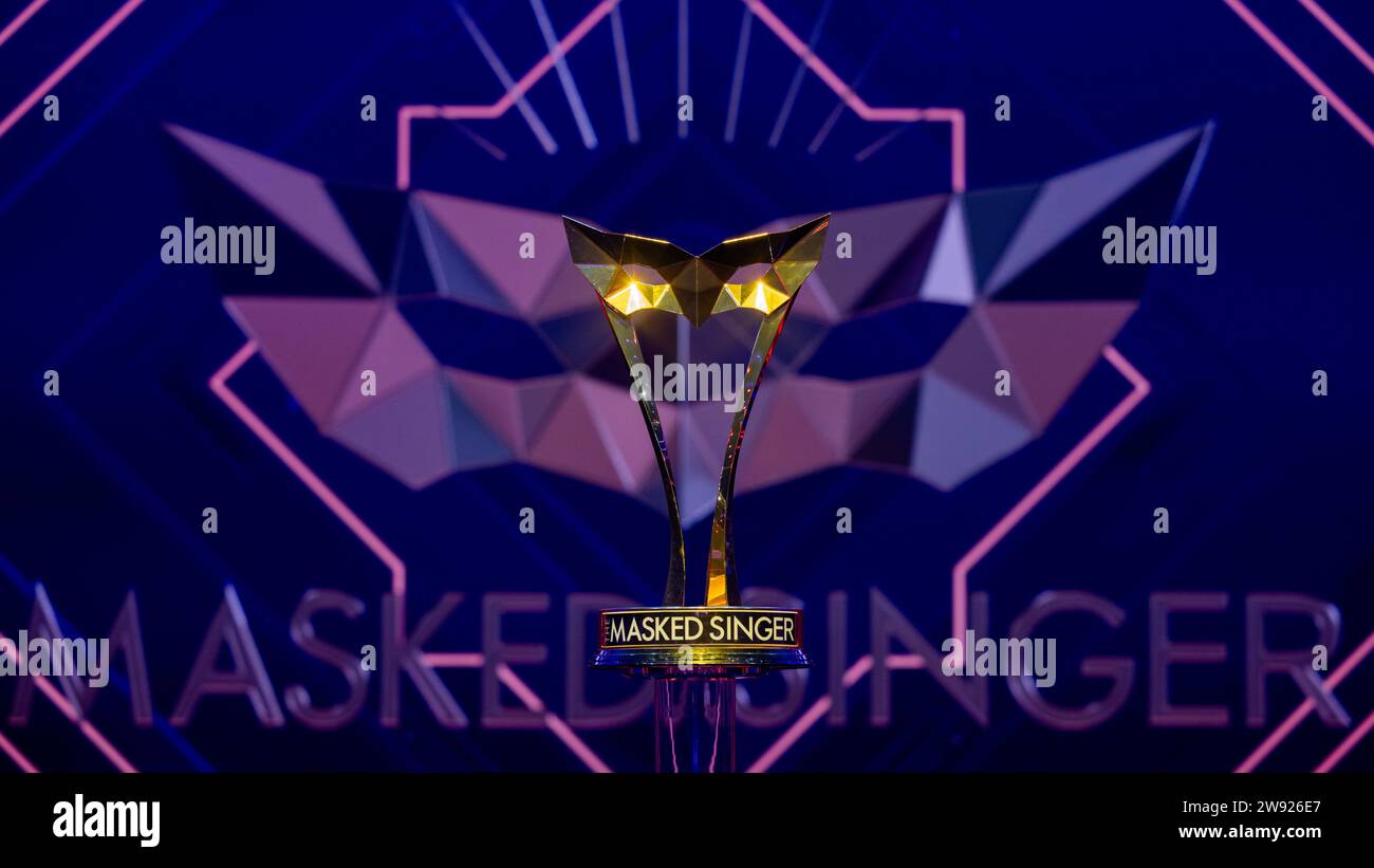 Cologne, Germany. 23rd Dec, 2023. The winner's trophy is presented on ...