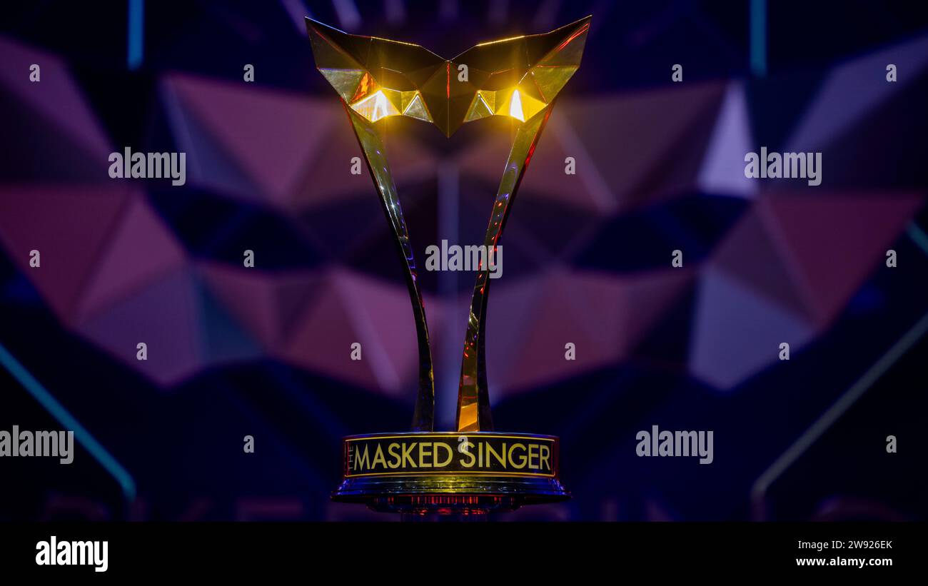 Cologne, Germany. 23rd Dec, 2023. The winner's trophy is presented on ...