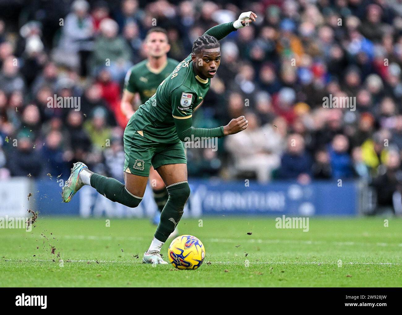 Bali Mumba #2 of Plymouth Argyle passes the ball forward during the Sky ...