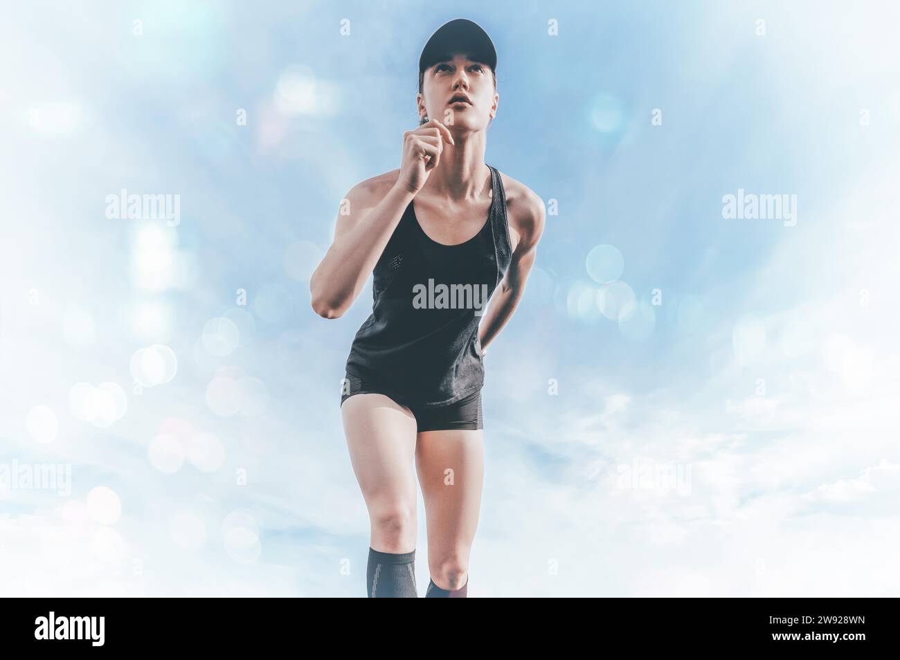 Professional runner stands on the track and prepares for the start of ...
