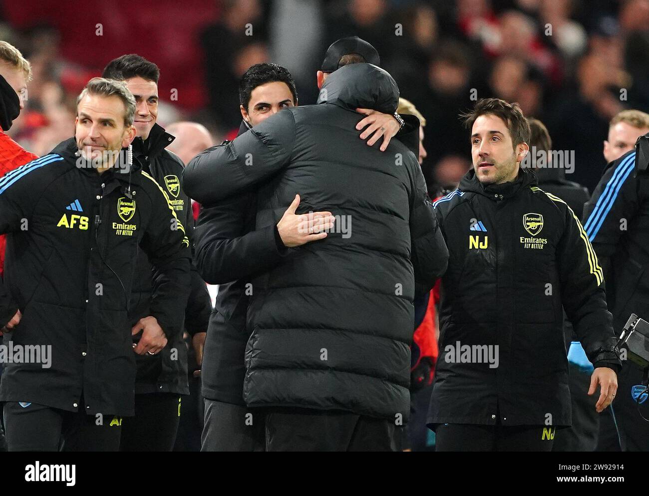 Arsenal manager Mikel Arteta (left) and Liverpool manager Jurgen Klopp embrace after the final ...