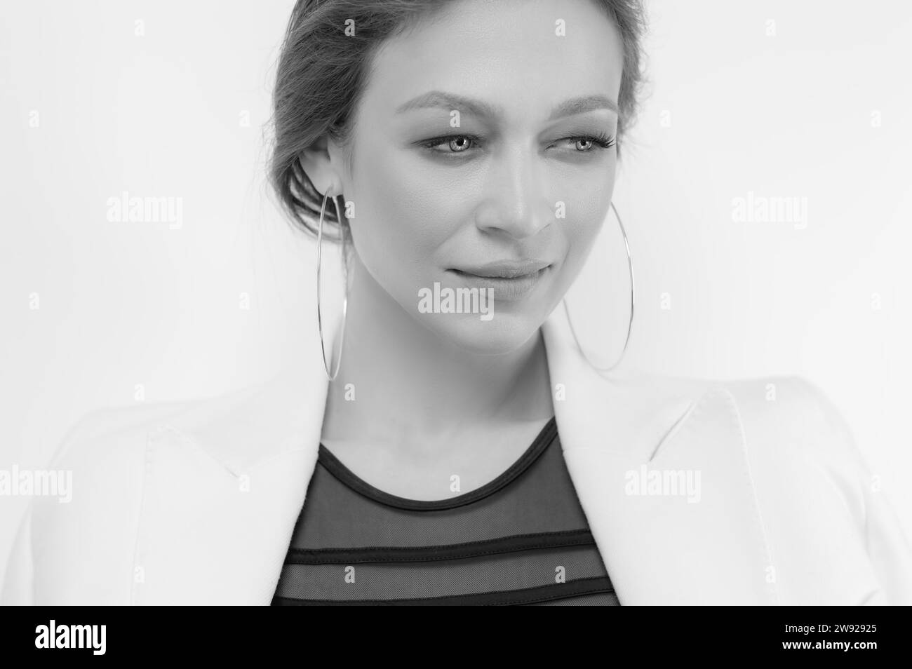 Portrait of a beautiful girl with a defiant make-up. White background ...