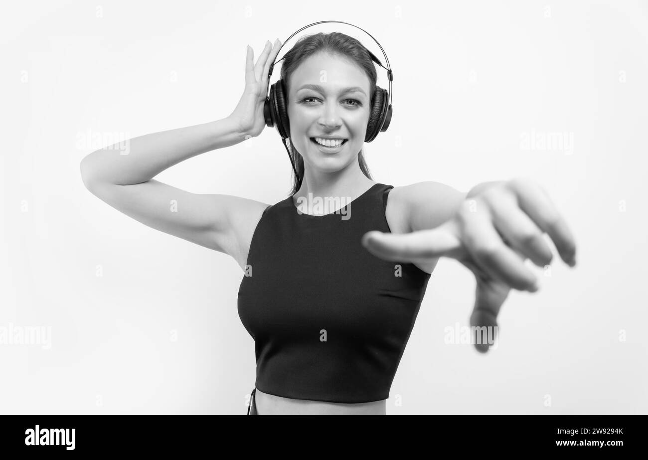 Portrait of a woman in professional headphones. White background. Dj ...