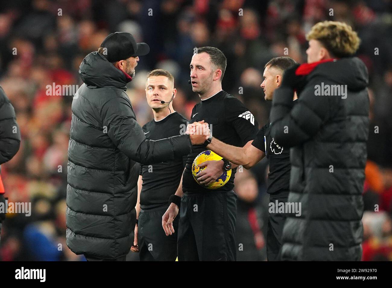Liverpool manager Jurgen Klopp (left) speaks with referee Chris ...