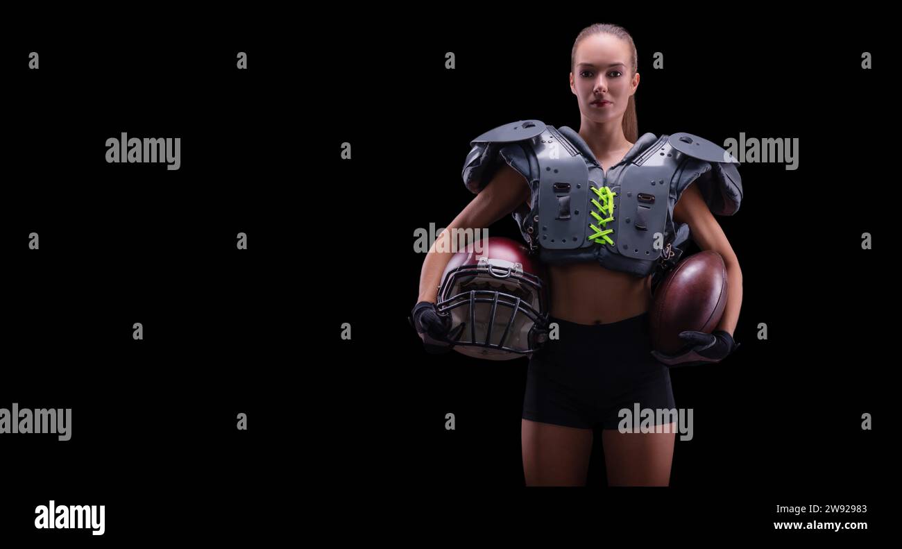 Portrait of a girl in the uniform of an American football team player ...