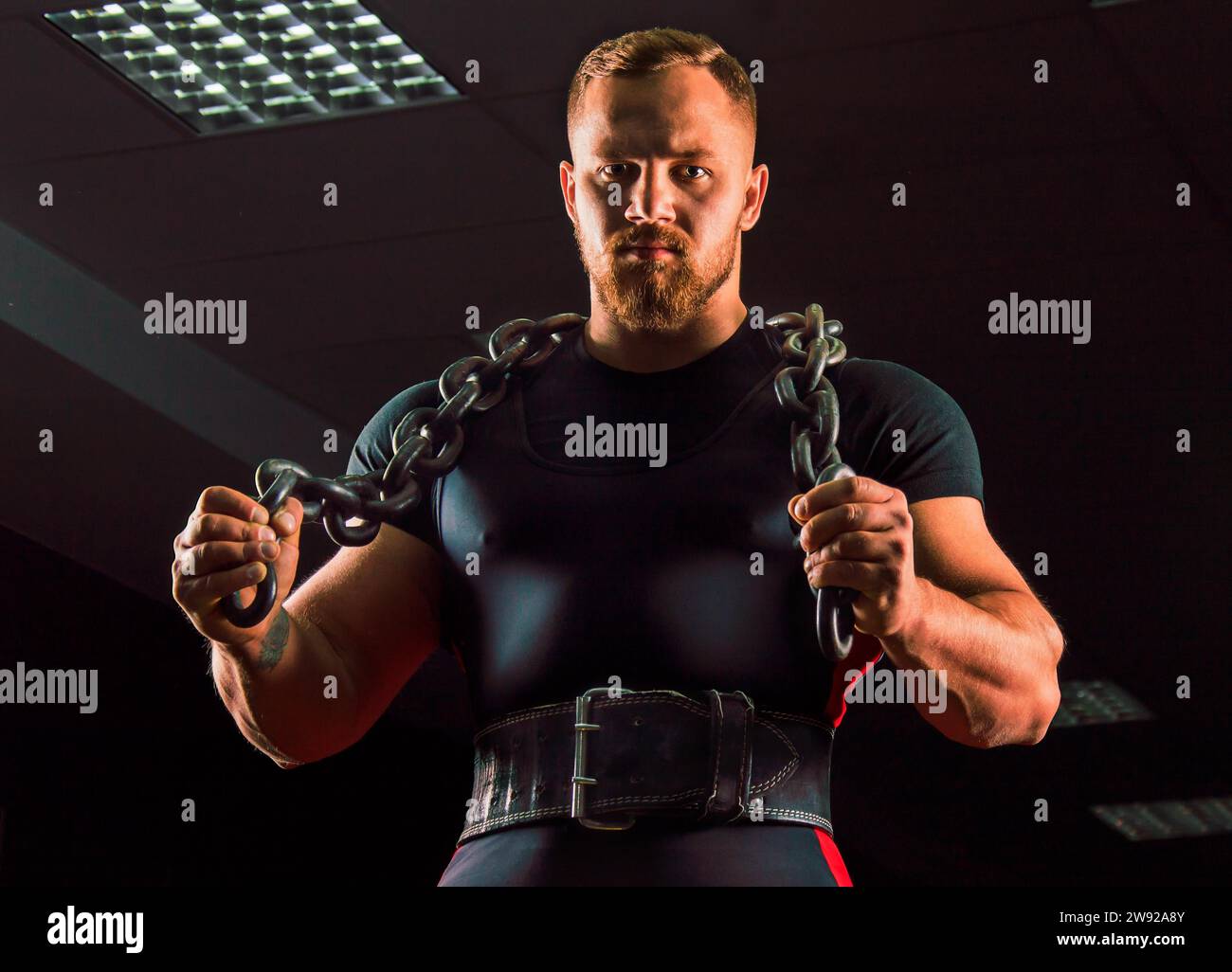 Huge weightlifter with a chain around his neck is in the gym Stock ...
