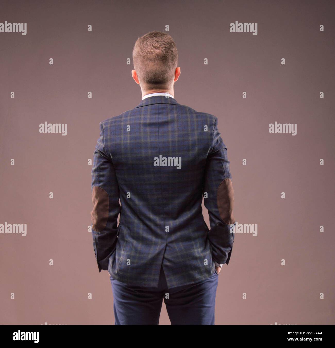 Man stands with his back to the camera and looking at something Stock ...